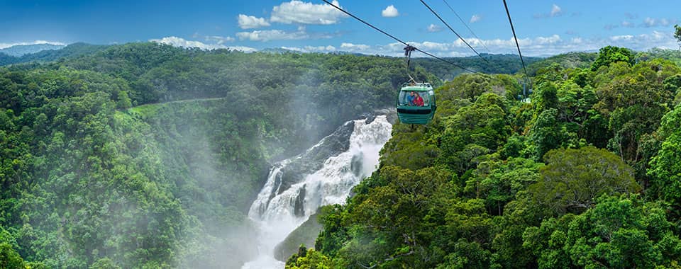 Barron-Falls-in-flood-with-gondola-wide - Kuranda